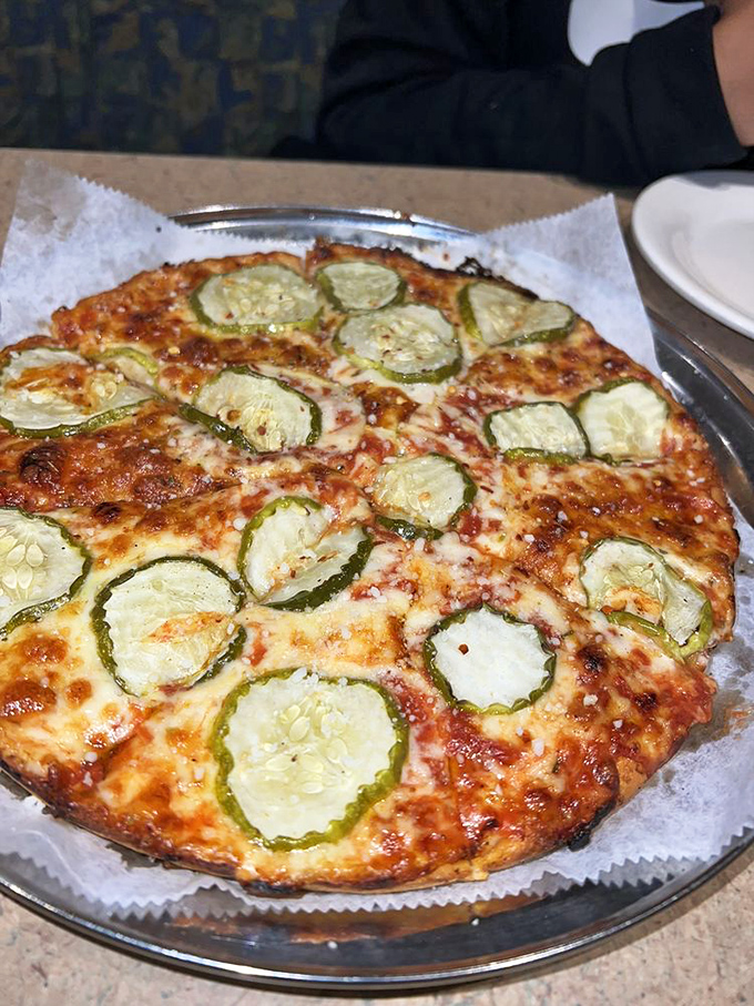 Pickles on pizza? It's not madness, it's genius! This tangy, briny creation is the conversation starter your taste buds have been craving.