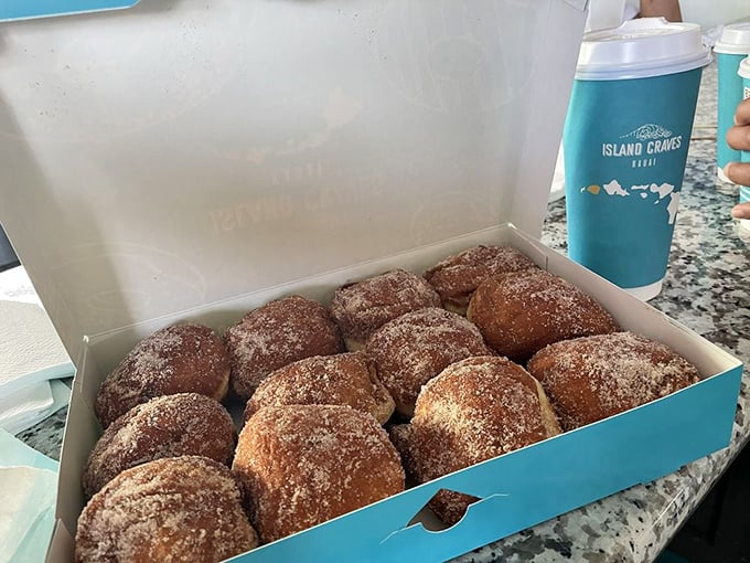 Malasadas: where "plain" is anything but boring. These sugar-dusted puffs of joy are Hawaii's answer to the donut.