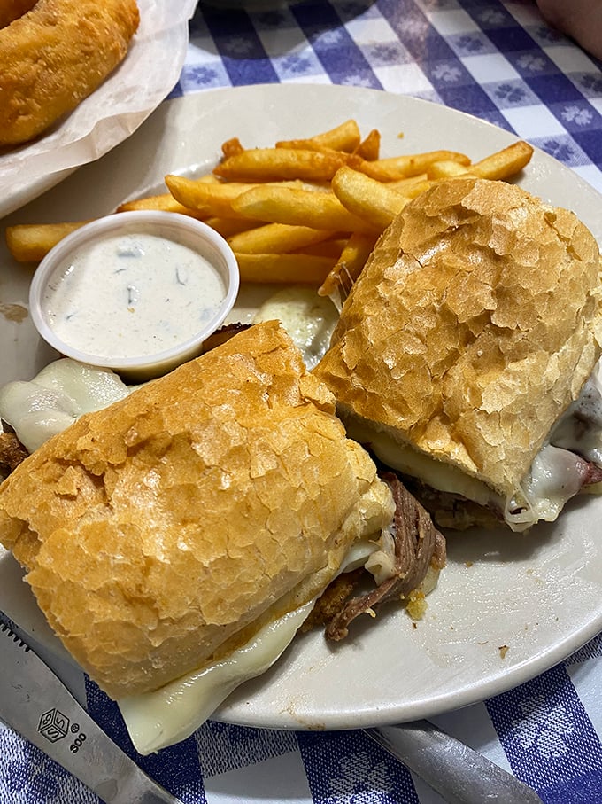 The holy trinity of comfort: prime rib, crispy fries, and a bun that deserves its own fan club. Napkins are not optional!