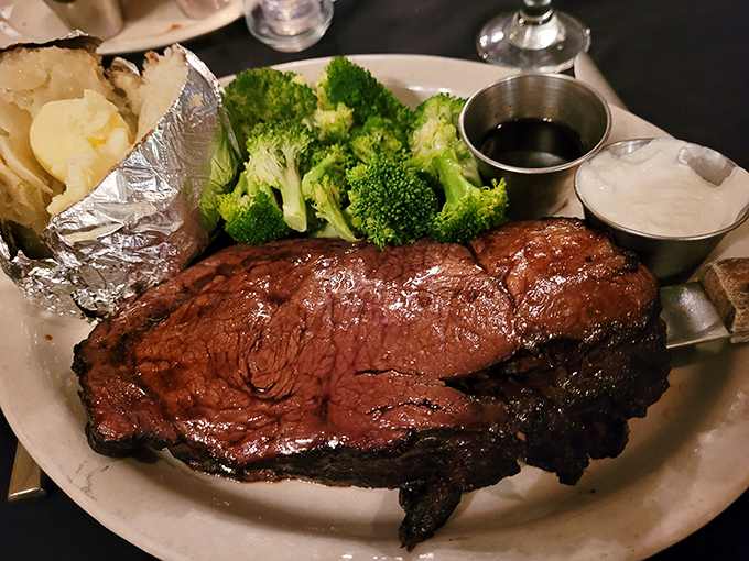 A prime rib so good, even the broccoli looks excited to be on the same plate. That baked potato is giving serious "supporting actor" vibes in this meaty blockbuster.