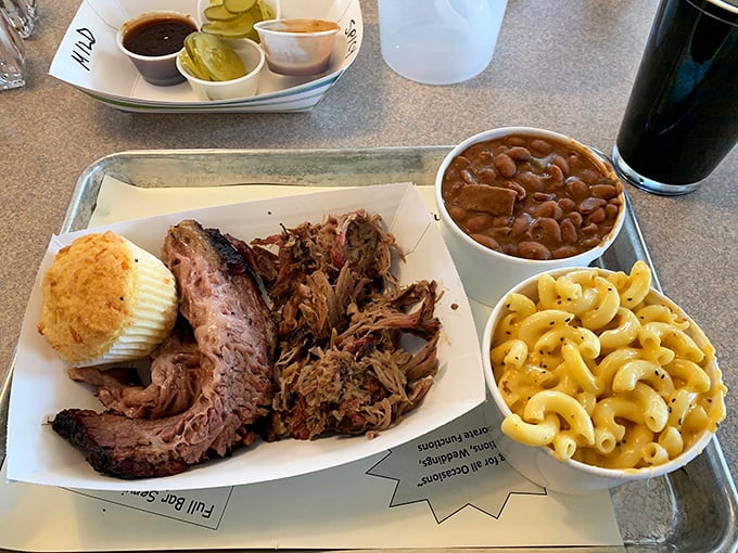 The dynamic duo of BBQ: pulled pork and brisket. It's like Batman and Robin, if they were deliciously smoked and fork-tender.