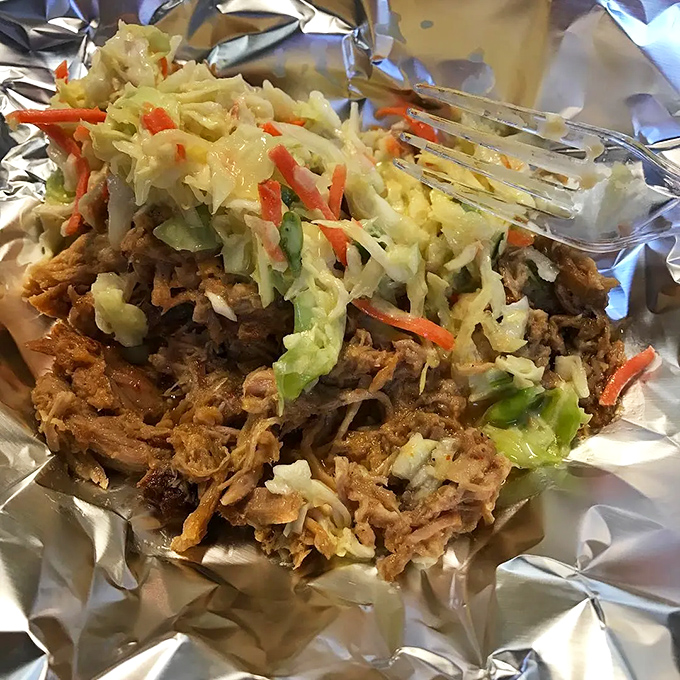 A colorful twist on tradition! Who knew barbecue could rock a veggie accessory? It's like the pork decided to hit the salad bar for a makeover.