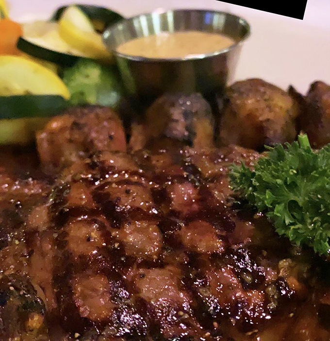 Surf and turf perfection. A ribeye that could make a vegetarian weep, paired with scallops that taste like they just jumped out of the ocean.