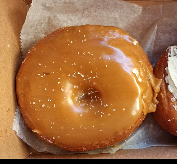 Behold, the golden child of donuts! This salted caramel creation is like a hug for your taste buds.