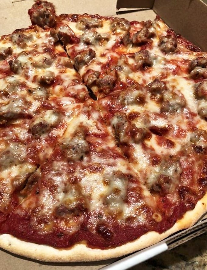 This sausage pizza isn't just a meal, it's a meaty masterpiece that would make Michelangelo weep with joy.