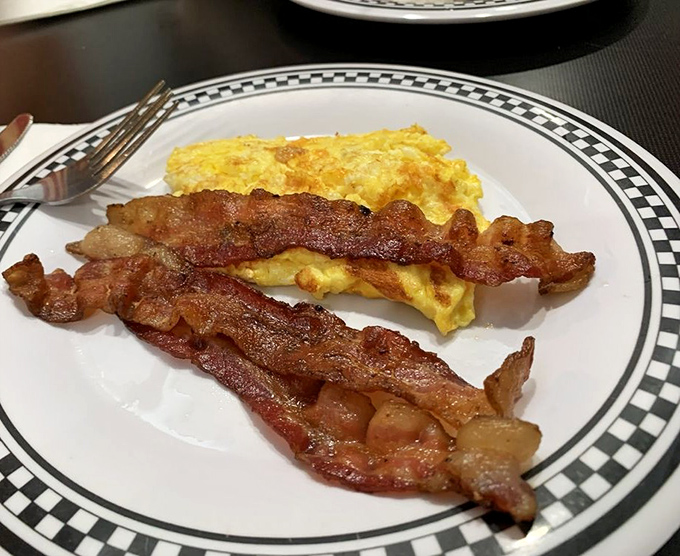 The dynamic duo of breakfast: crispy bacon and fluffy scrambled eggs. Simple, classic, and always ready to save the day (or at least your morning).