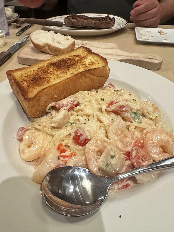 Pasta that would make an Italian grandmother nod in approval, topped with enough seafood to make Poseidon jealous. Now that's amore!