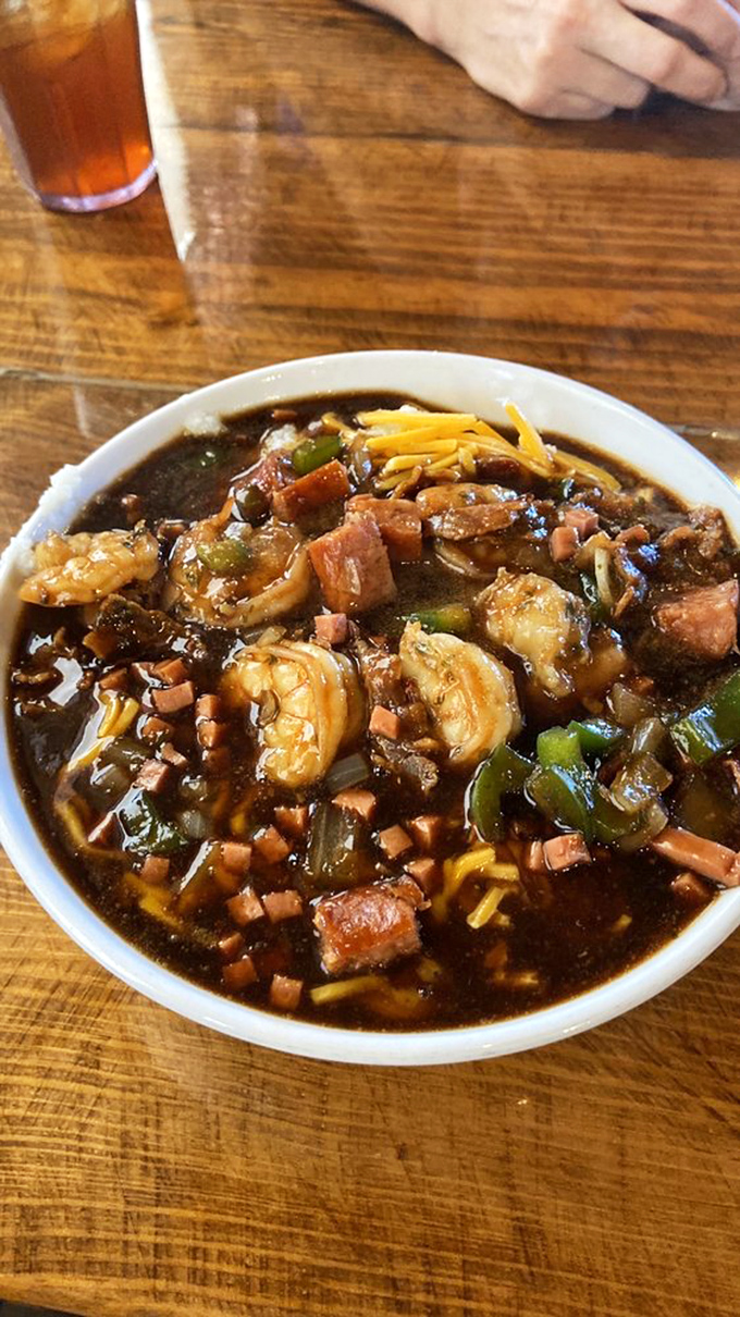 A bowl of Southern charm: shrimp and grits that'll make you want to hug your spoon. It's like a warm, cheesy embrace for your taste buds.