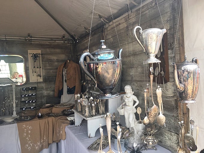 Silver treasures gleam under canvas, waiting for new homes. Yesterday's elegant entertaining pieces become tomorrow's conversation starters.