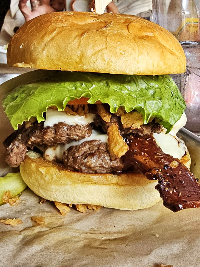 This bacon-topped smashburger is so perfectly stacked, it could give the Leaning Tower of Pisa lessons in balance.