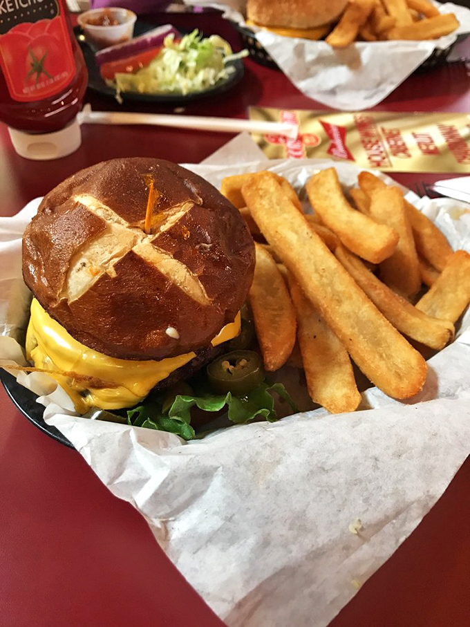 Beware the Towering Inferno! This burger is hotter than a Wyoming summer and taller than a cowboy's tale. Brace yourself for a flavor rodeo.