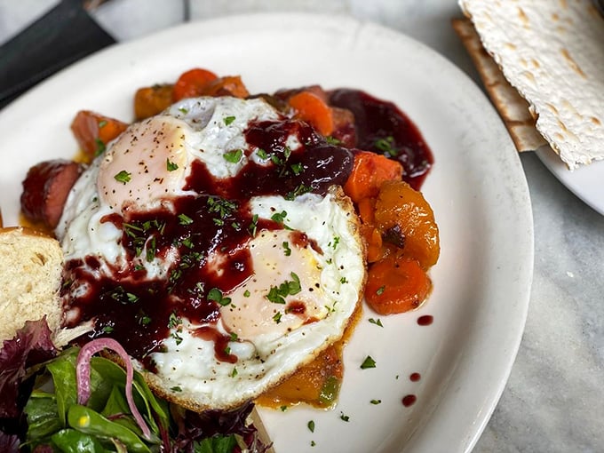The Tzimmes omelette brings sweet and savory to breakfast with a ruby-red splash of beet reduction. Protein never looked so photogenic.