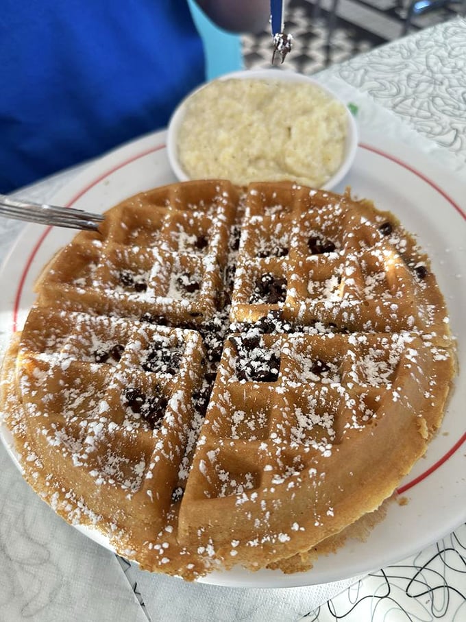 Golden crisp meets creamy comfort. This waffle and grits duo is the breakfast equivalent of Simon and Garfunkel &ndash; perfectly harmonious.
