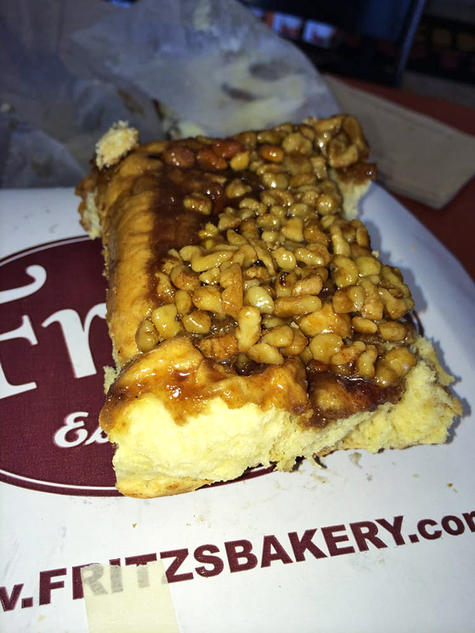 Sticky situation alert! This walnut-topped bun is so gooey, you might need a napkin... or three.