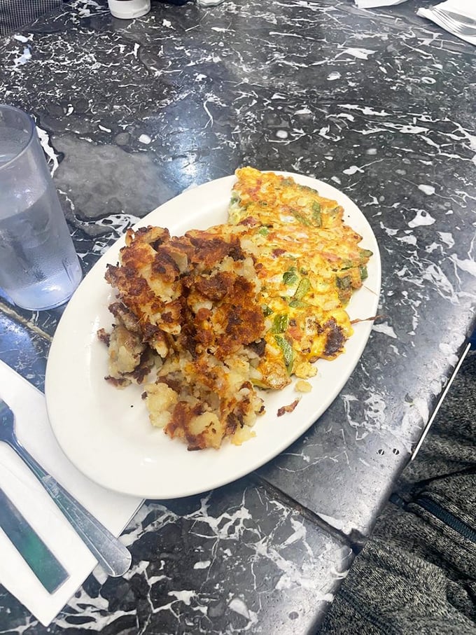 This isn't just breakfast &ndash; it's edible architecture. Layers of Taylor ham, eggs, and potatoes creating the skyscraper of satisfaction every New Jerseyan dreams about.