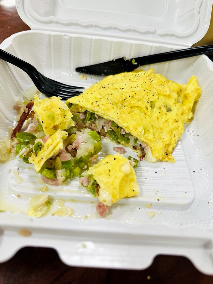 This Western omelet doesn't just contain vegetables&mdash;it celebrates them. A fluffy yellow canvas painted with green peppers and ham.