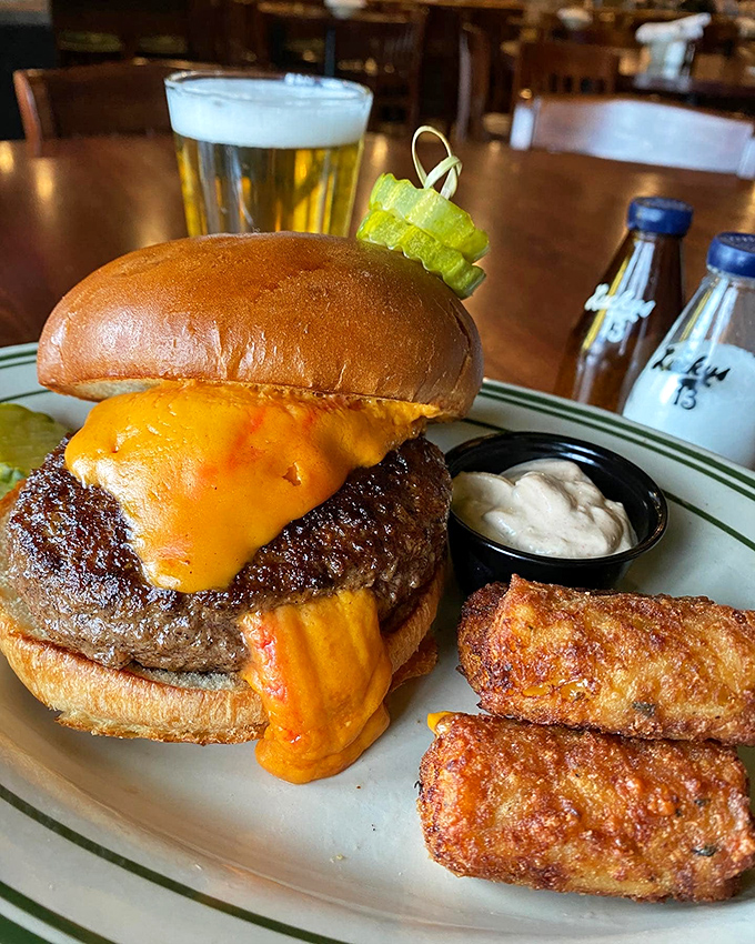 The Wino Burger: where beef meets brew in holy matrimony. With cheese oozing like lava and a bun toasted to perfection, it's love at first bite.