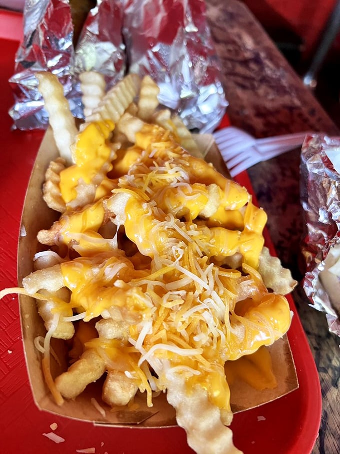 Cheesy does it! These fries are so smothered in gooey goodness, they could star in their own dairy-tale romance.