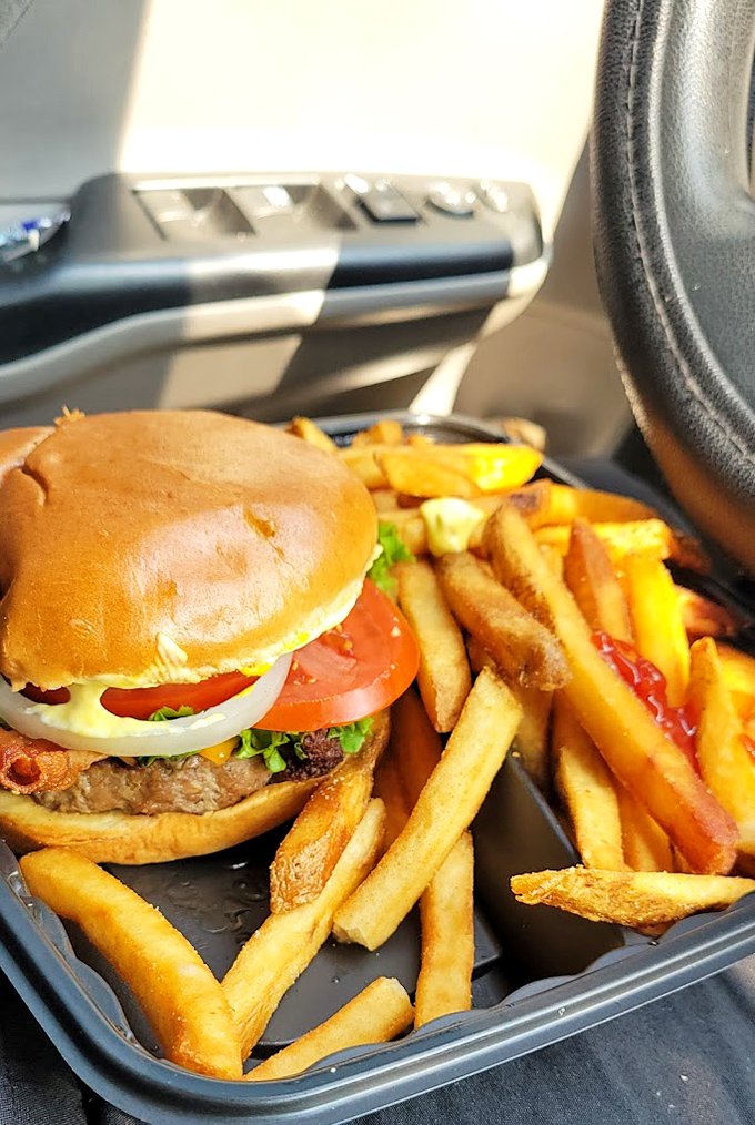 The classic American road trip, served on a plate. This burger and fries combo is the edible equivalent of a Bruce Springsteen song.