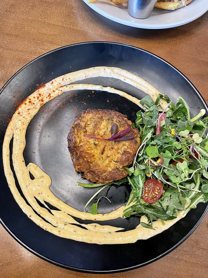 This crab cake is living its best life, surrounded by a moat of sauce fit for seafood royalty. Talk about plate goals!