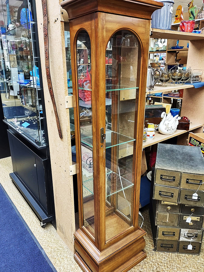 Mirror, mirror, on the wall, who's the most elegant of them all? This curio cabinet could make even Marie Antoinette jealous.