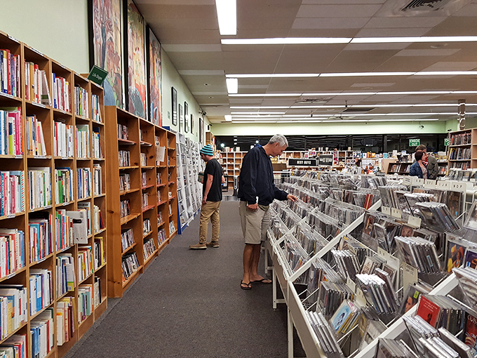 Bookworms in their natural habitat! Watch as fellow readers navigate this labyrinth of literature, hunting for their next great read.