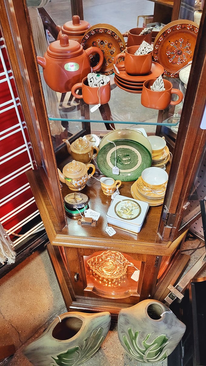 Grandma's china cabinet comes to life with terracotta teapots and delicate dishware that whisper of Sunday dinners and special occasions past.