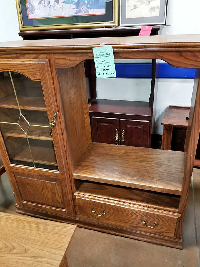 Solid oak craftsmanship at yard sale prices. Someone's grandmother probably watched "Dallas" on this entertainment center before flat screens changed everything.