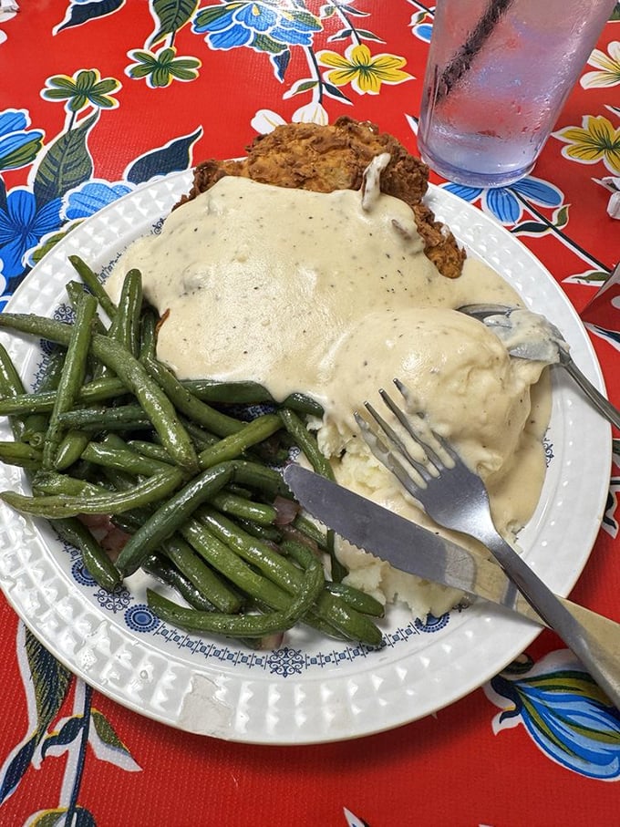 Southern comfort meets Midwest charm! This chicken fried steak, smothered in gravy and paired with green beans, is proof that sometimes the best things in life come breaded and fried.