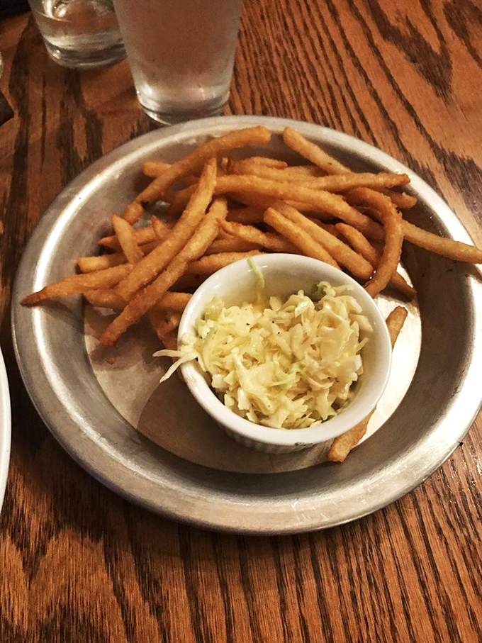 Fries and slaw: The dynamic duo of sides. These golden fries are the Butch Cassidy to coleslaw's Sundance Kid – a perfect pairing for any main event.