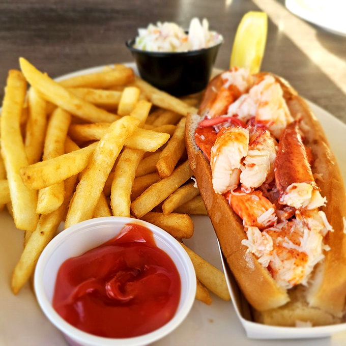 French fries and lobster: the dynamic duo of seaside dining. It's like Batman and Robin, if Batman was a crustacean and Robin was crispy and golden.