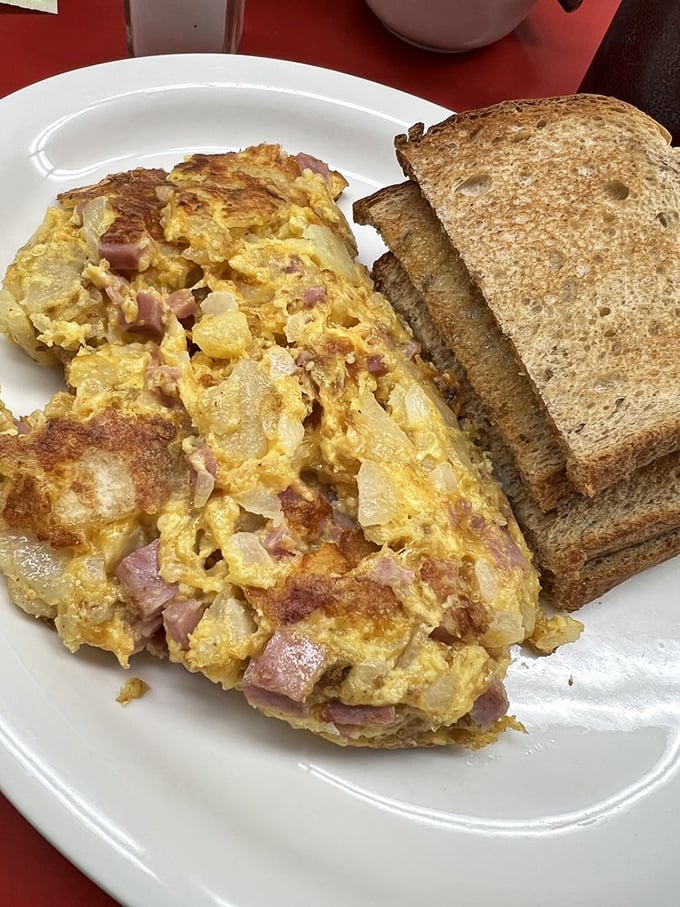 "Garbage" that belongs in the Smithsonian, not a trash can. This magnificent mess of eggs, potatoes, ham, and cheese is hangover medicine in food form.