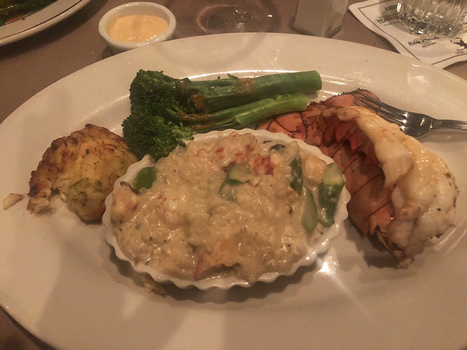 Who knew risotto could make you weak in the knees? This creamy masterpiece, topped with lobster, is like a warm hug for your taste buds.