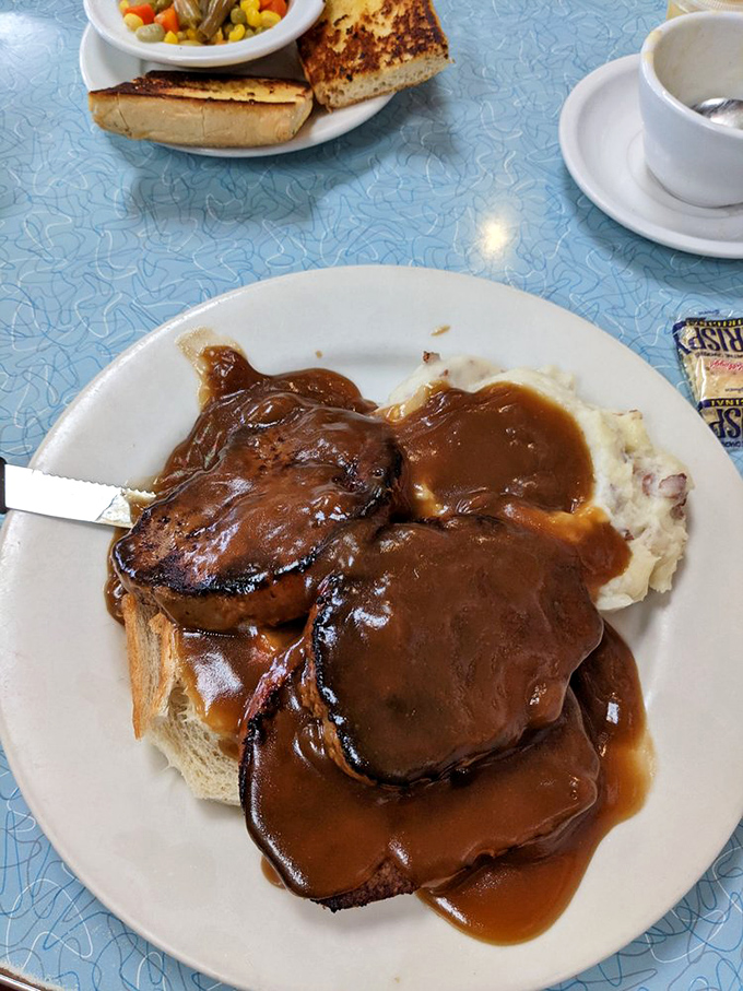 This isn't just meatloaf&mdash;it's a gravy-drenched time machine transporting you straight to the comfort of your grandmother's kitchen.