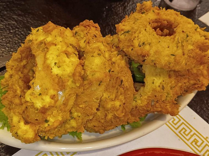 Crispy, golden, and utterly addictive. These onion rings are the jewelry of the fried food world – you'll want to wear them proudly.