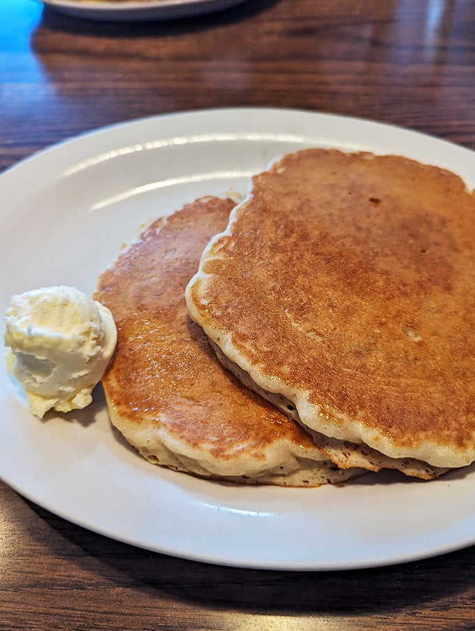 Pancakes so golden and fluffy, they could double as pillows. Just add butter, syrup, and prepare for a breakfast that's nothing short of dreamy.