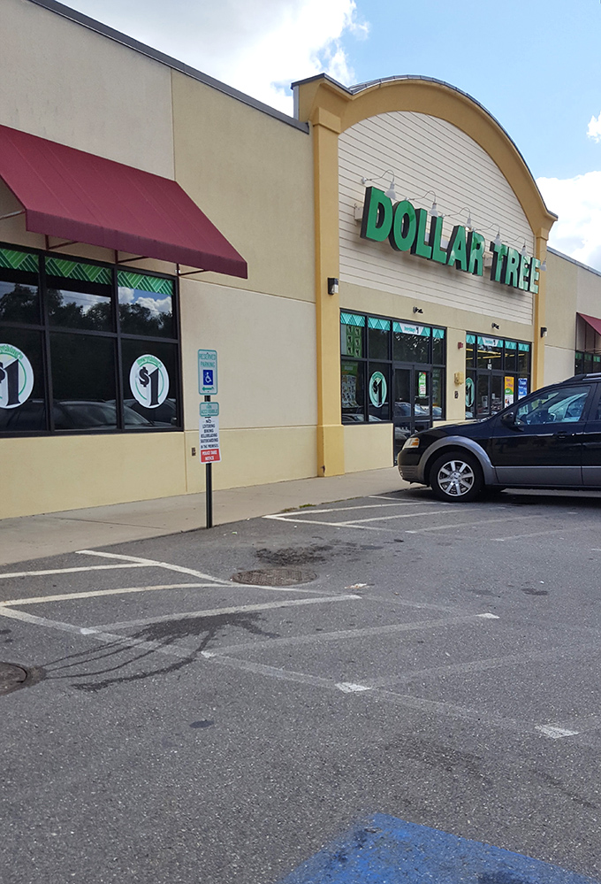 The curved architectural flourish adds unexpected elegance to this budget paradise, where handicap spaces ensure bargain hunting is accessible to everyone.