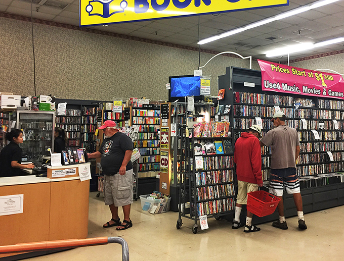 Observe the rare sight of humans interacting with physical media. It's like watching a nature documentary about the pre-streaming era.