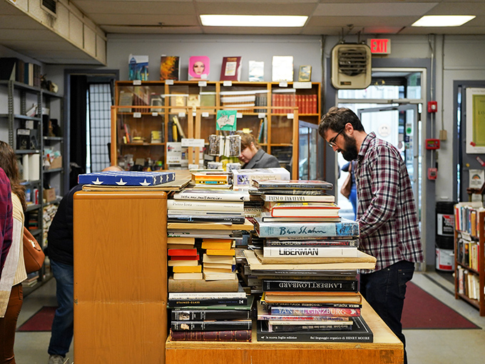 Treasure hunters at work! These literary prospectors sift through mountains of tomes, hoping to strike intellectual gold.
