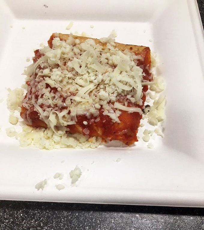 A slice of heaven on a plate! This pizza square is so inviting, it's practically winking at you.