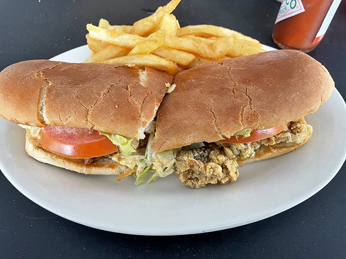 The po' boy that'll make you rich in flavor! This sandwich is a perfect harmony of crispy seafood, fresh veggies, and pillowy bread.