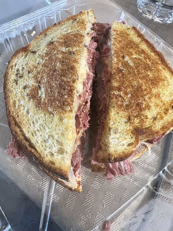Behold, the Reuben in all its glory! This sandwich is stacked higher than a Jenga tower, promising a flavor explosion with every perfectly toasted bite.