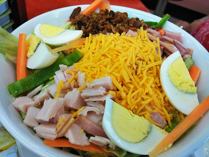 Who said salads can't be fun? This colorful creation is like a garden party on a plate, with enough cheese to make even the most devoted carnivore smile.