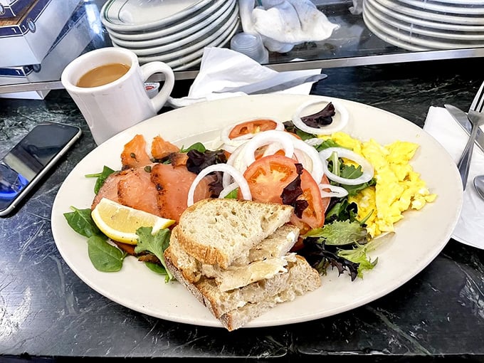 Who says breakfast can't be sophisticated? Smoked salmon, mixed greens, and scrambled eggs create a morning symphony.