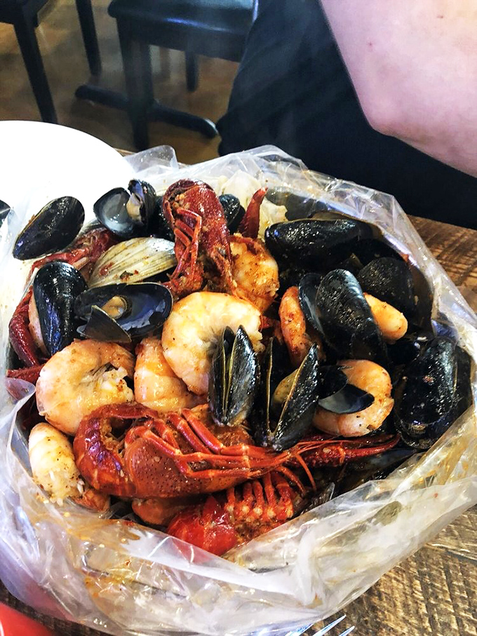 Seafood lovers, rejoice! This boil bag is a maritime fiesta. It's like a treasure chest, but instead of gold, you find delicious sea critters.