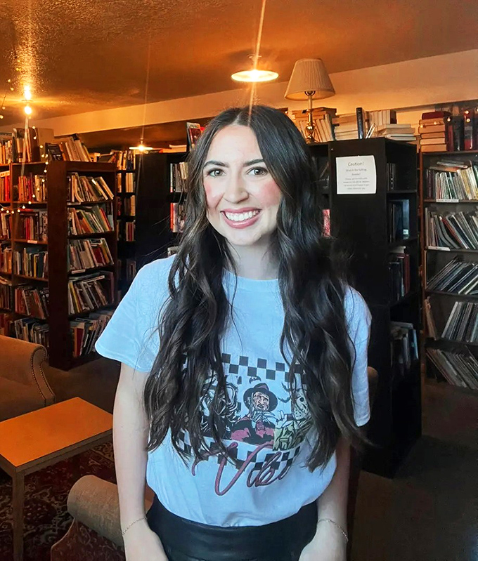 Books and smiles: a perfect pairing! This cozy corner of The Book Shelf invites you to lose yourself in stories while surrounded by the warm glow of literary treasures.