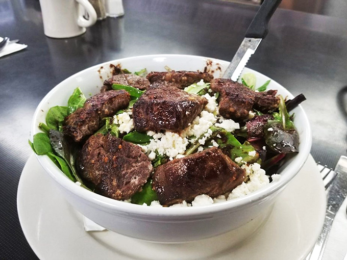 Who said salads can't be exciting? This steak-topped creation is like a garden party where the cow crashed – in the best way possible.