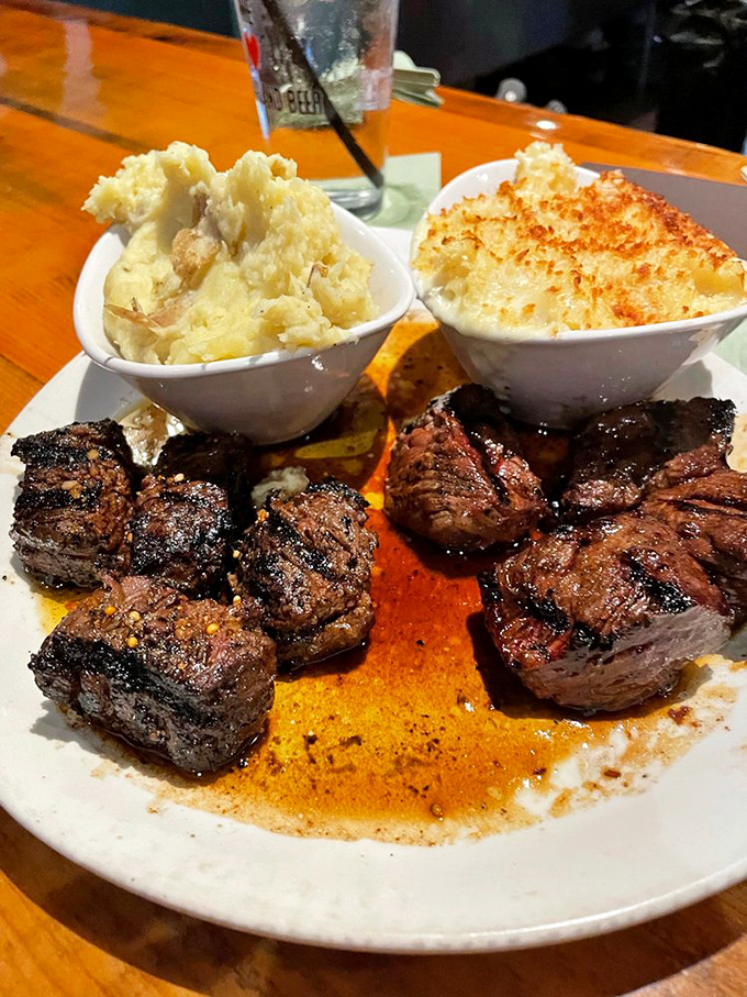 Steak tips and heavenly sides share a plate in beautiful harmony, like a delicious rock band where every member gets their moment to shine.
