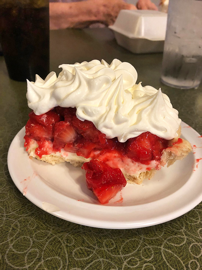 Summer captured on a plate. This strawberry pie with its crown of whipped cream makes you understand why people write songs about simple pleasures.