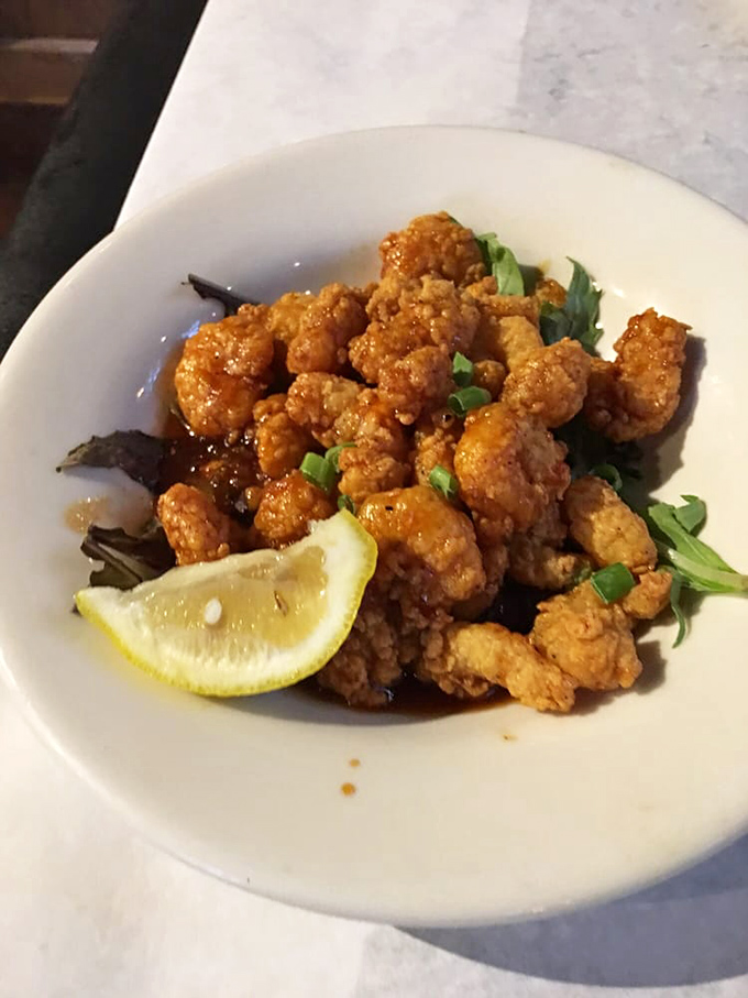 Voodoo Shrimp: Where Cajun magic meets seafood perfection. These crispy crustaceans are so addictive, they should come with a warning label!